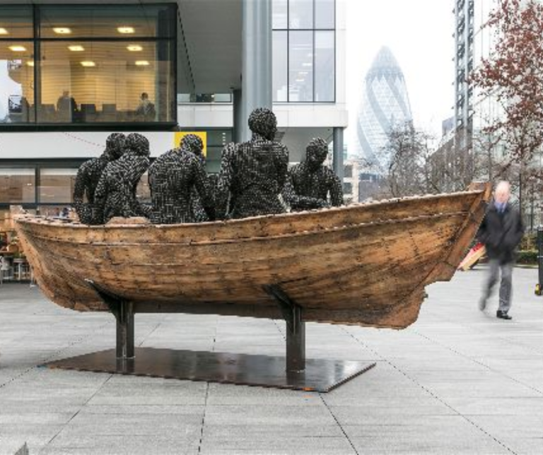 Art in And By Fire: Wooden Boat with Seven People | Evie Hawtrey
